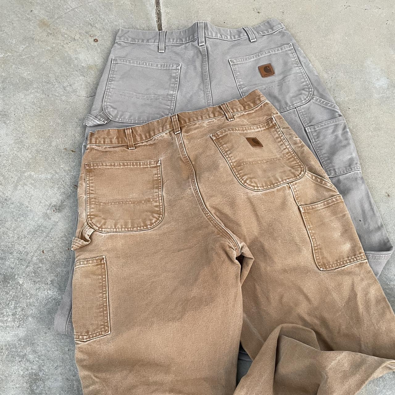 Two pairs of carhartt carpenter pants both are size... - Depop