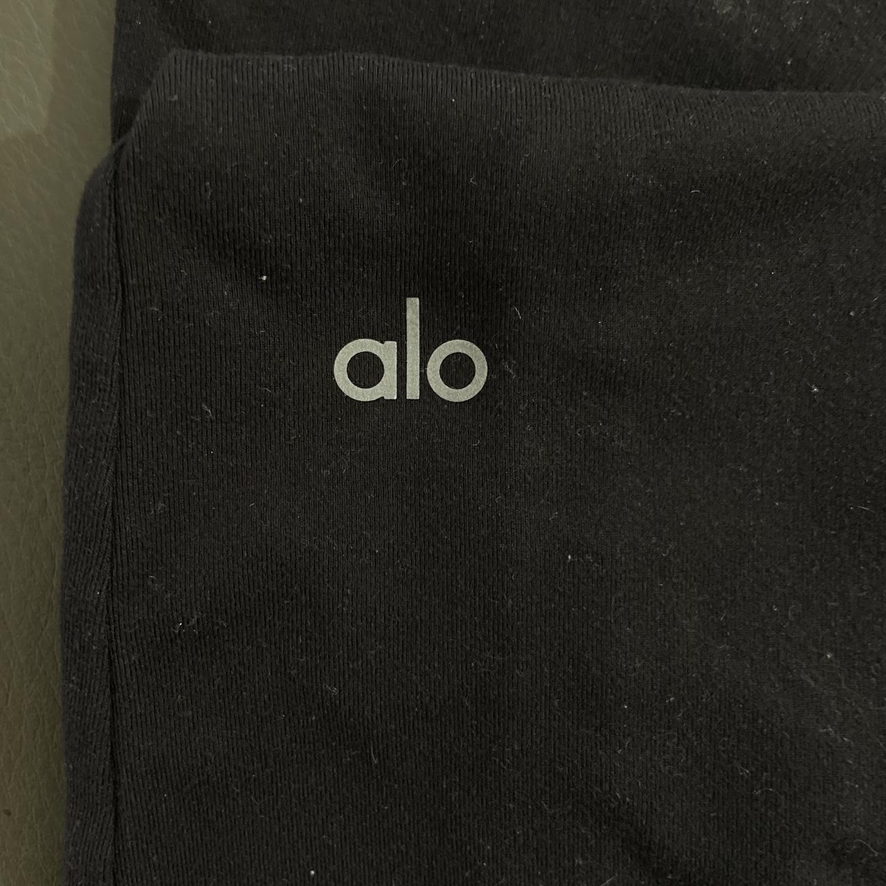 ALO black flared leggings with midline cut full... - Depop