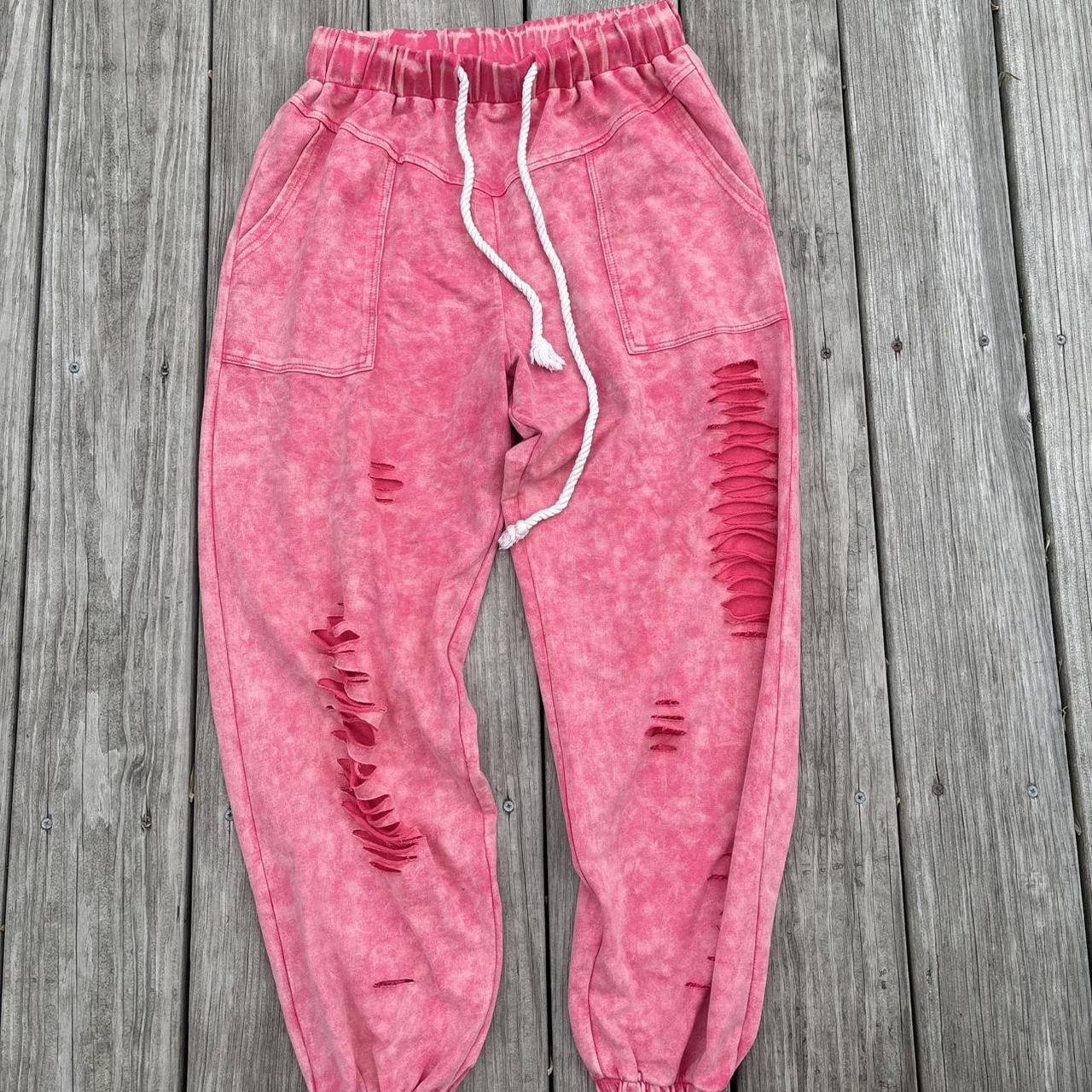 Pink distressed sweatpants with drawstring waist... | Depop