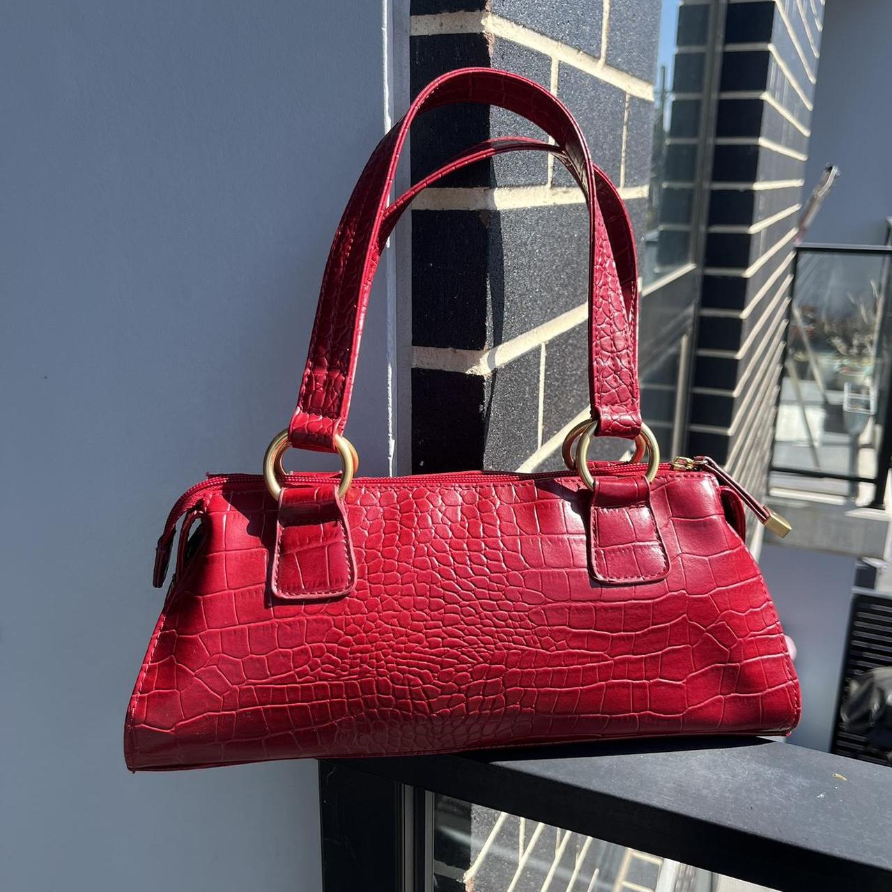 Red faux leather east/west bag with gold hardware.... - Depop