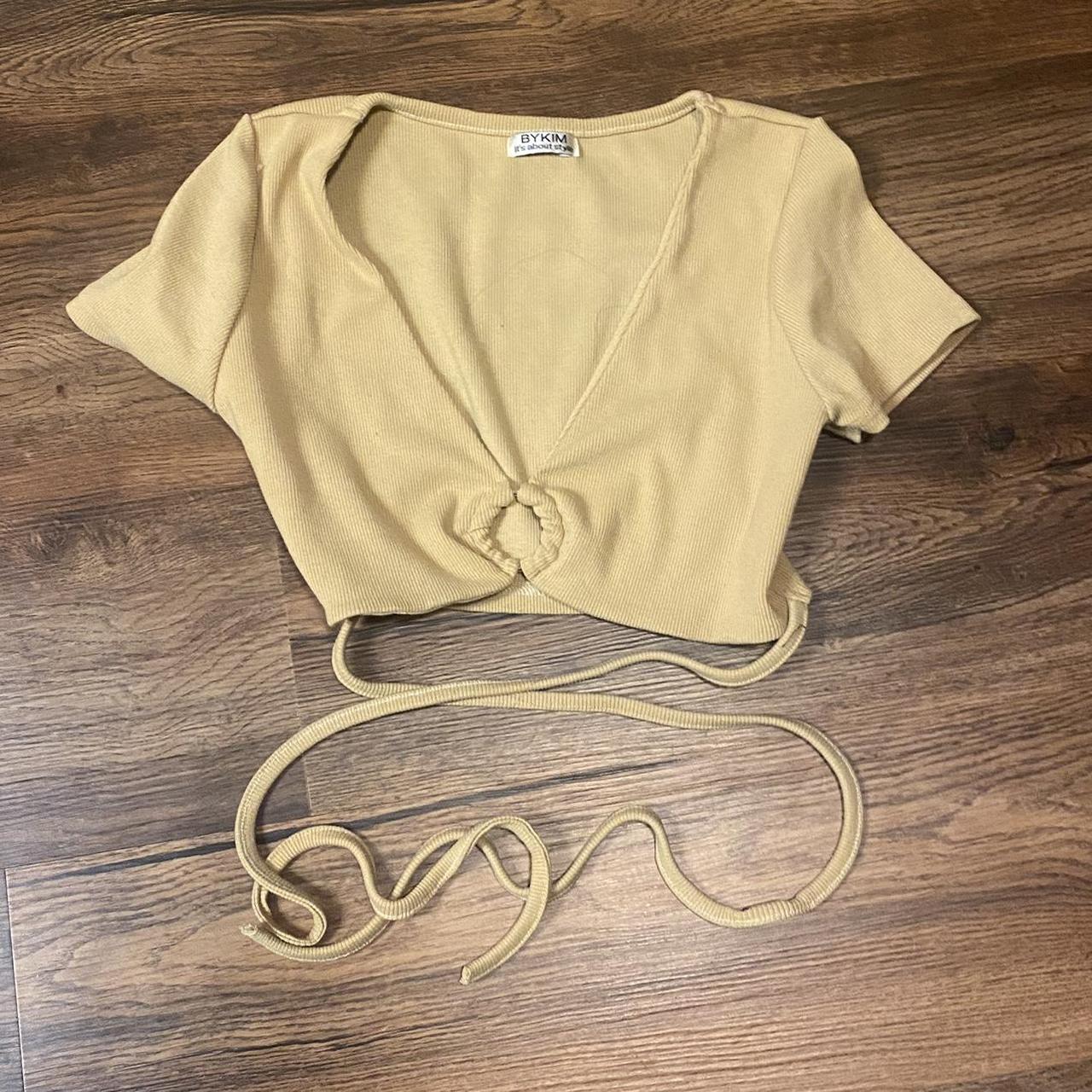 Womens small crop top with strings to tie around the... - Depop