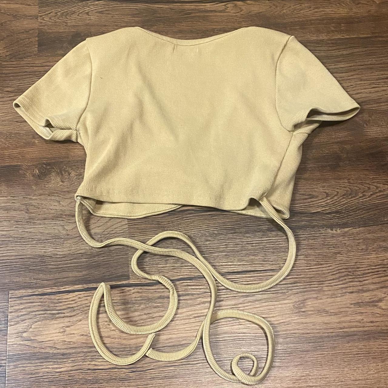 Womens small crop top with strings to tie around the... - Depop