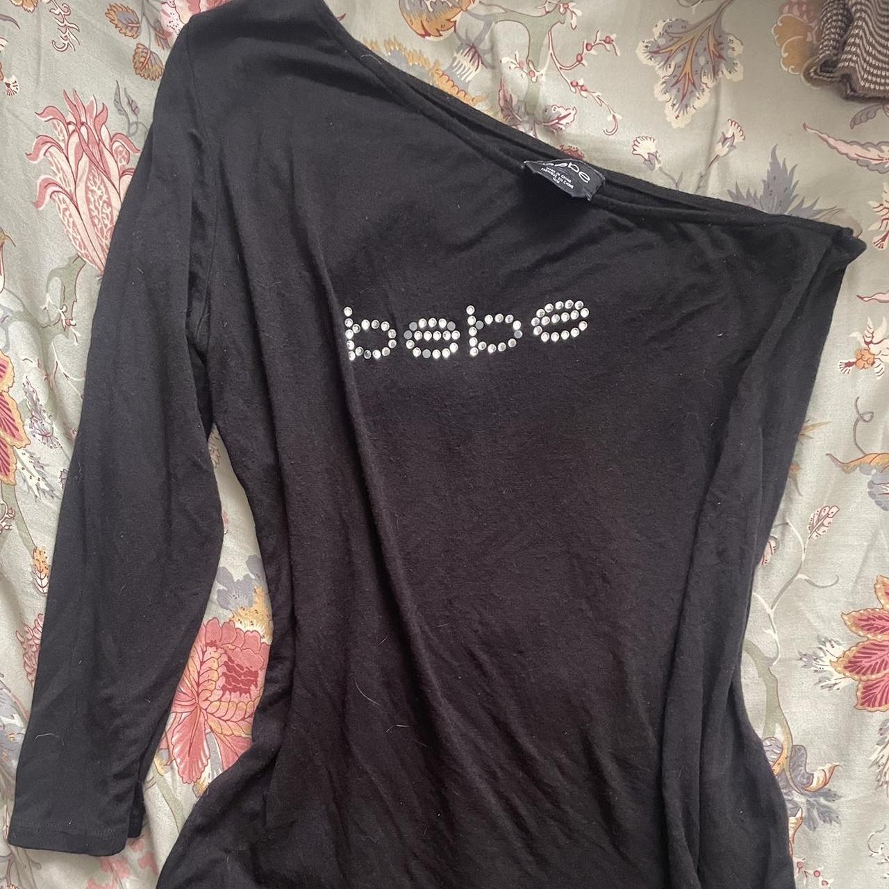Bebe shirt with one sleeve off the shoulder #bebe... - Depop