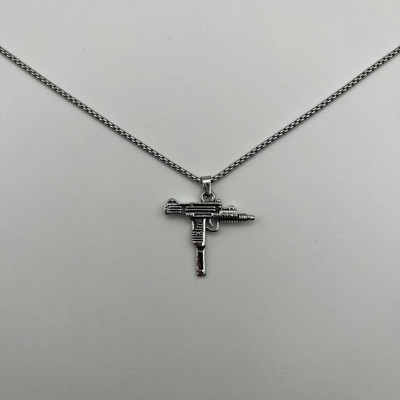 y2k 2000s mini uzi silver necklace these chains are... - Depop