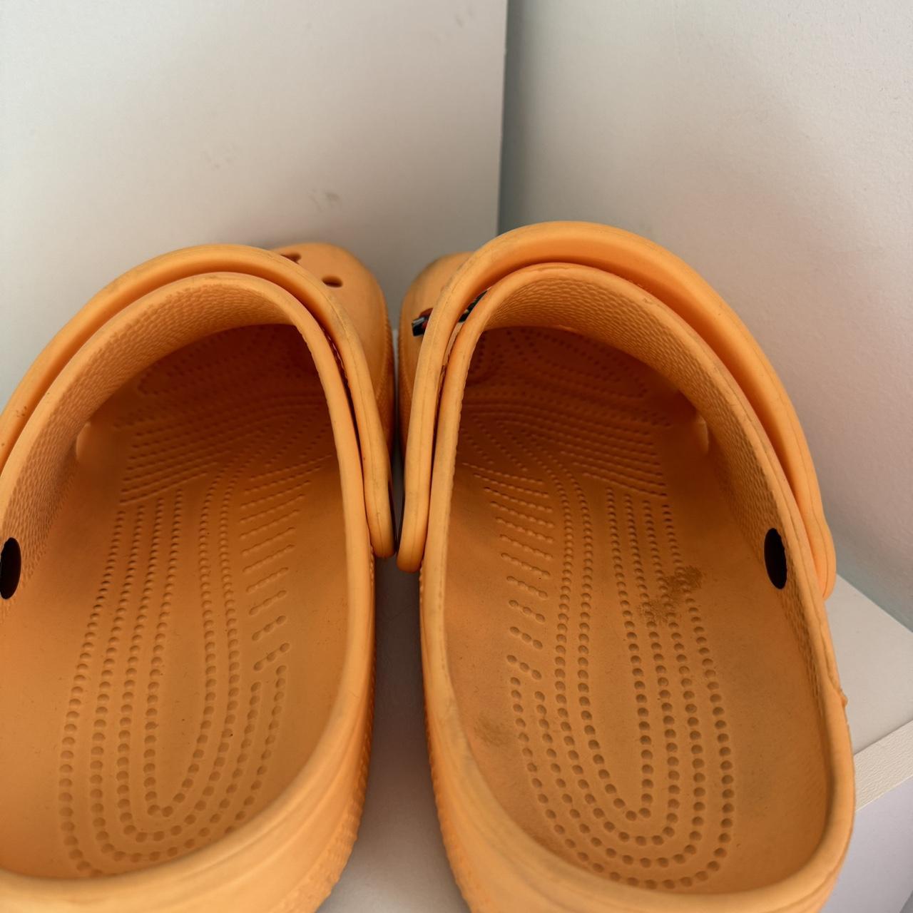 Orange crocs with jibits size 10M, 12W - Depop