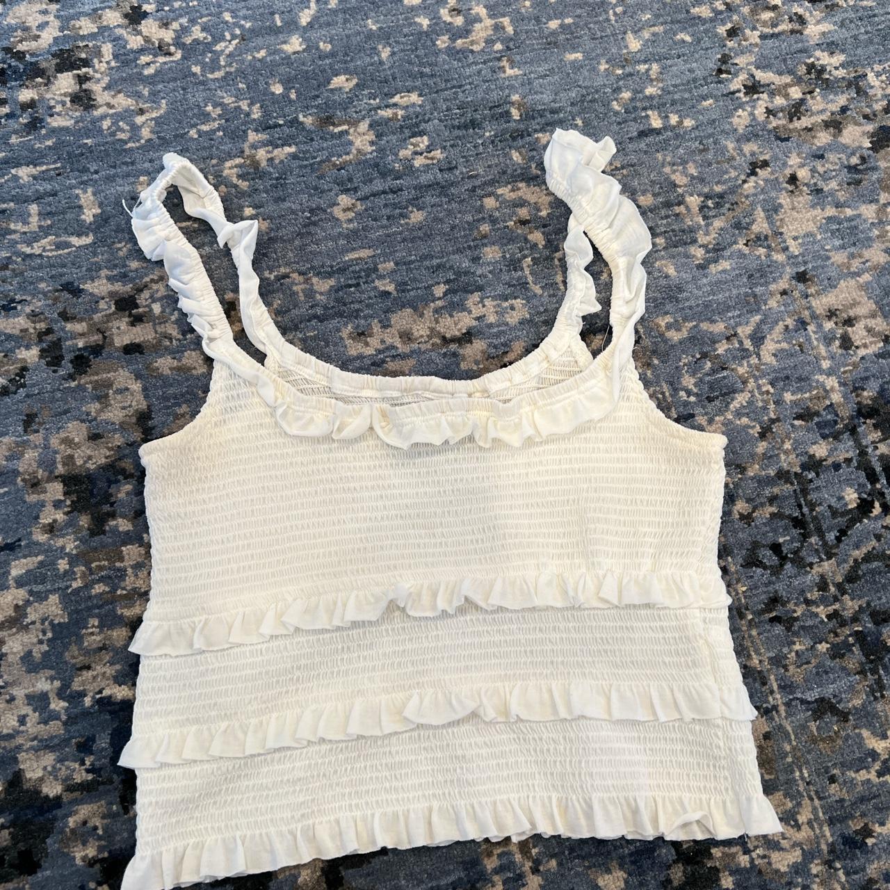 White ruffle tank from Urban Outfitters #croptop... - Depop
