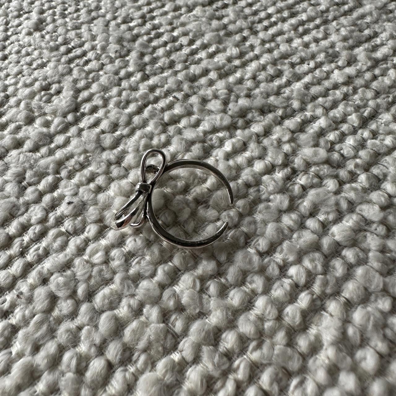 Silver ribbon ring adjustable open back. Paired with... - Depop