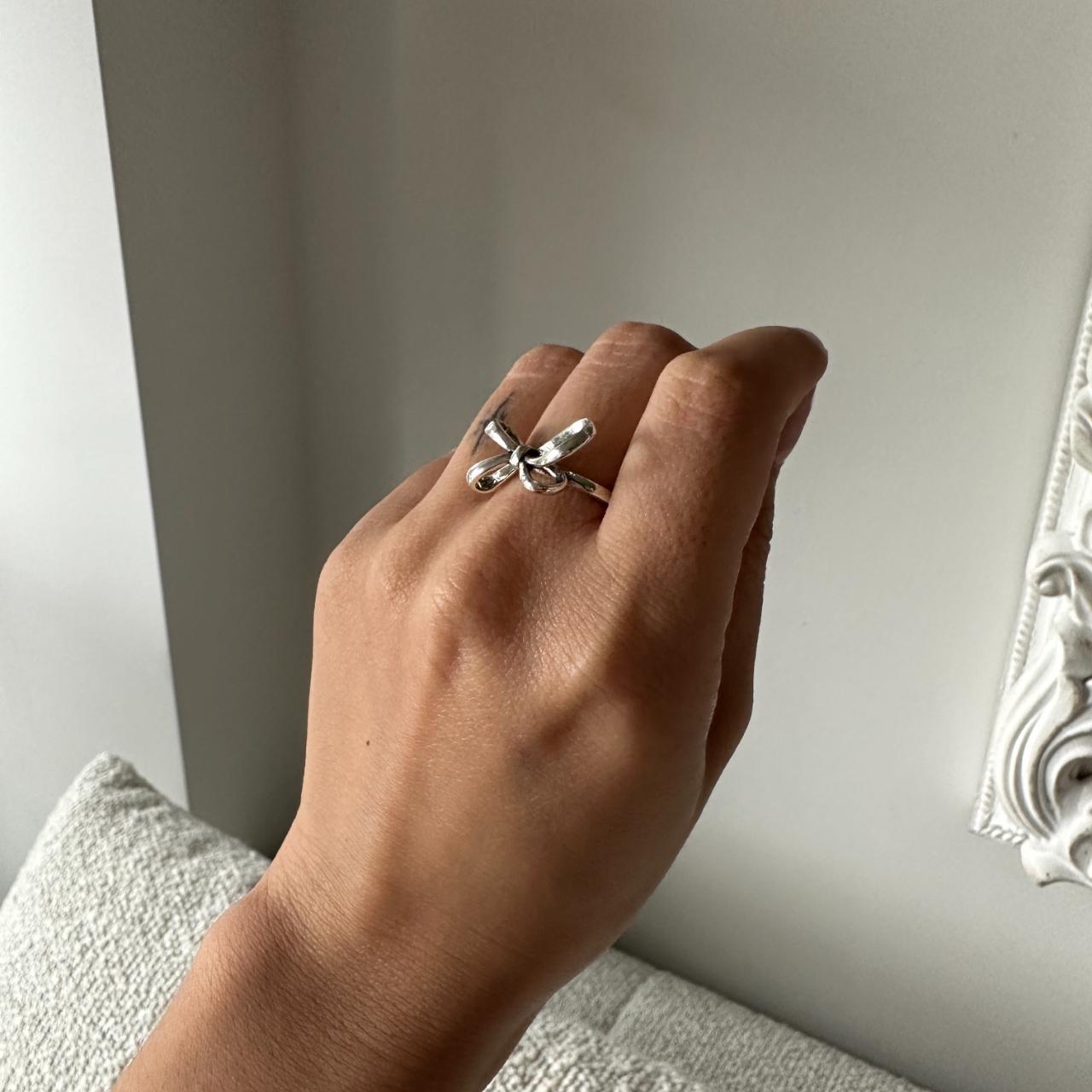 Silver ribbon ring adjustable open back. Paired with... - Depop