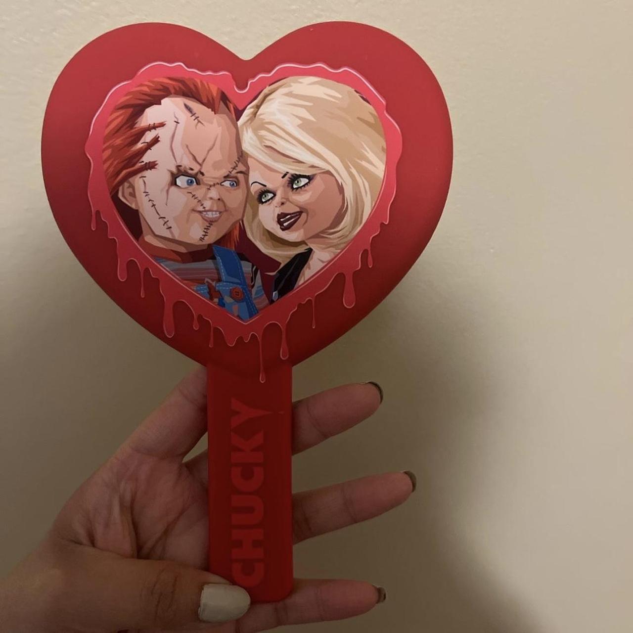 Hand held chucky heart shape romance is dead mirror... - Depop
