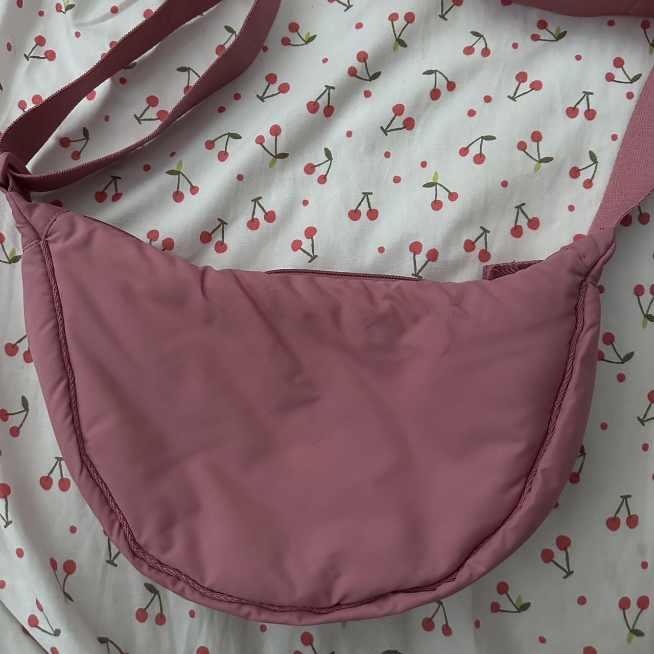 uniqlo dumpling bag in pink only used once... - Depop