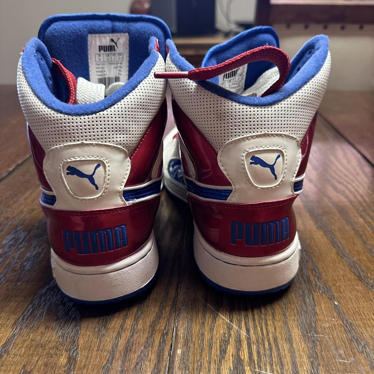 Puma red and white high-top trainers been used once... | Depop