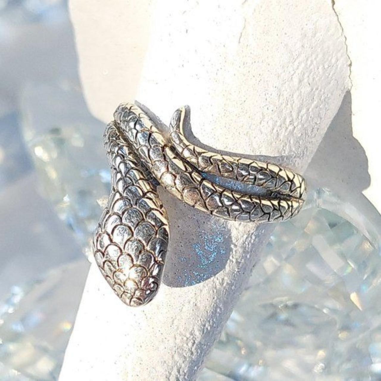 Capturing the slithering sinuosity of the snake,... - Depop