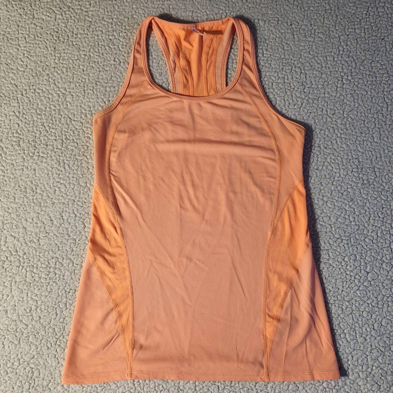 This is a two-toned, orange, athletic tank from the... - Depop