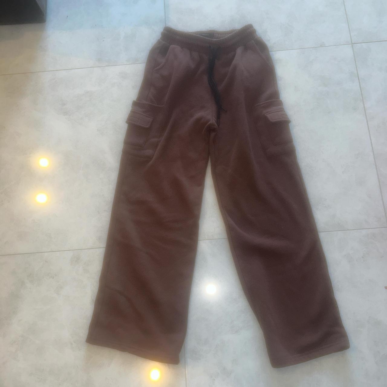 Brown cargo sweatpants with pockets. size small -... - Depop