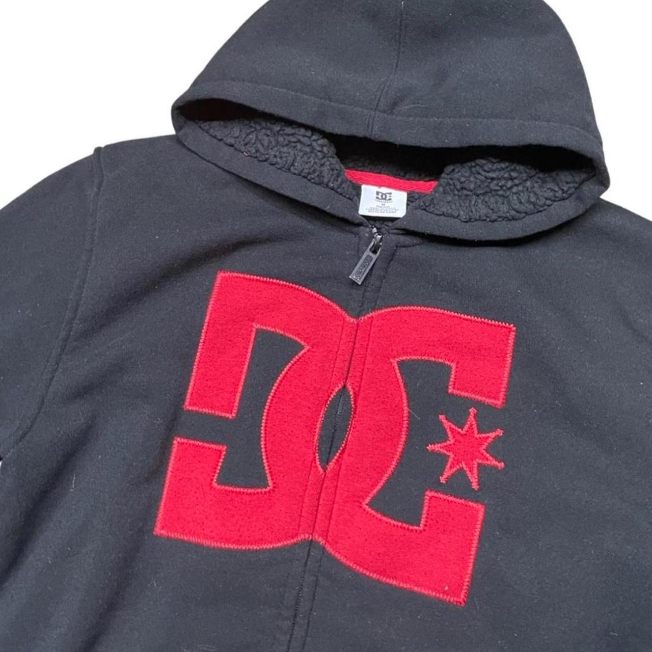 DC shoes black and red zip up hoodie tagged a size... - Depop