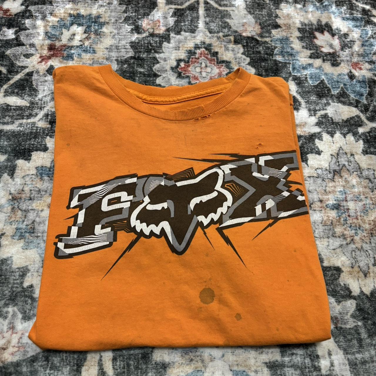 Orange Fox Racing tee has flaws throughout the shirt... - Depop