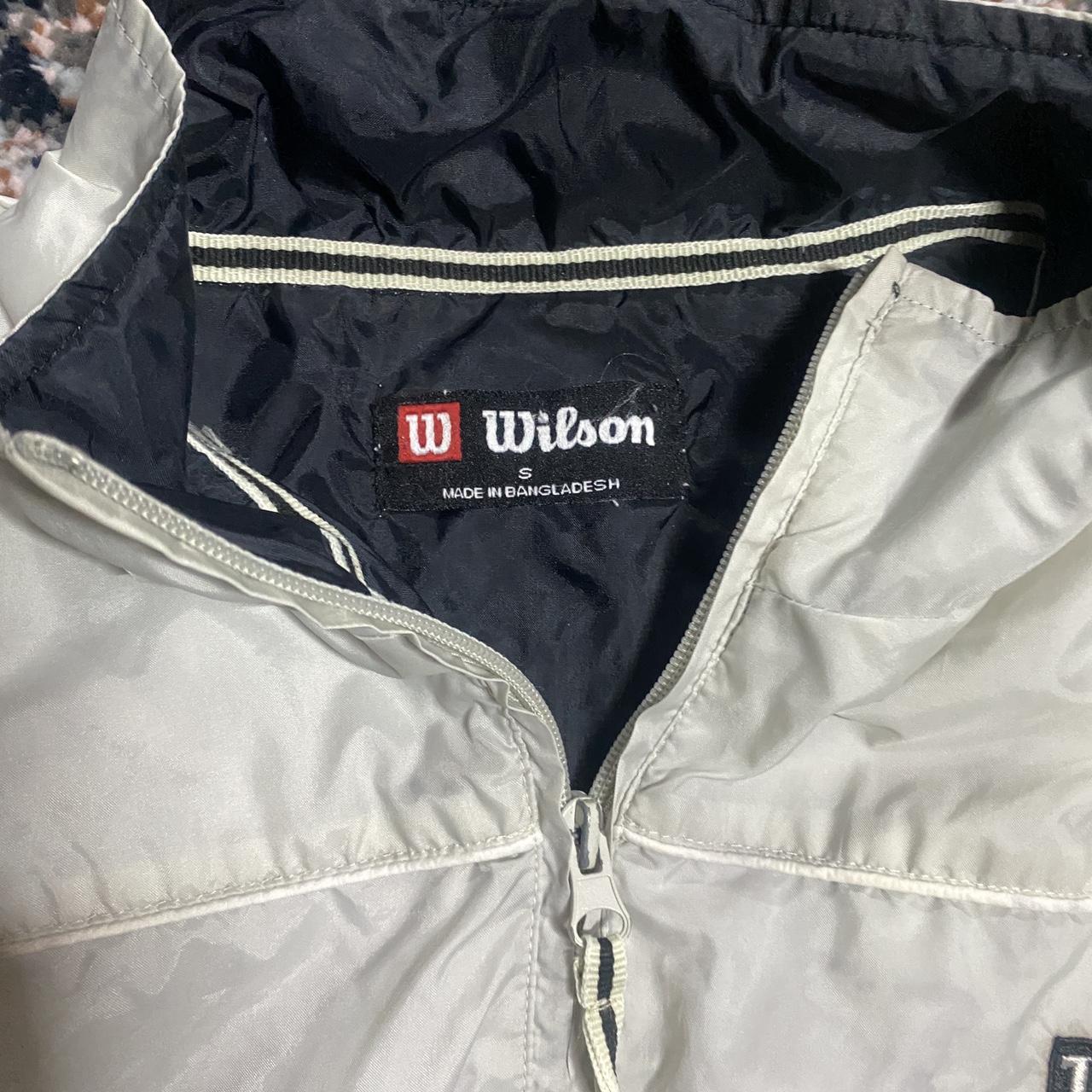 White and black vintage Wilson windbreaker stained... - Depop