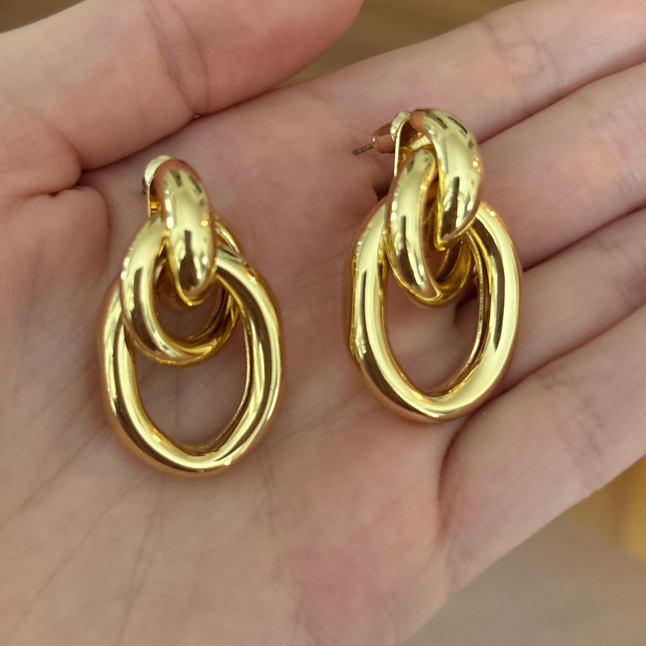 gold geometric earrings. never worn. - Depop