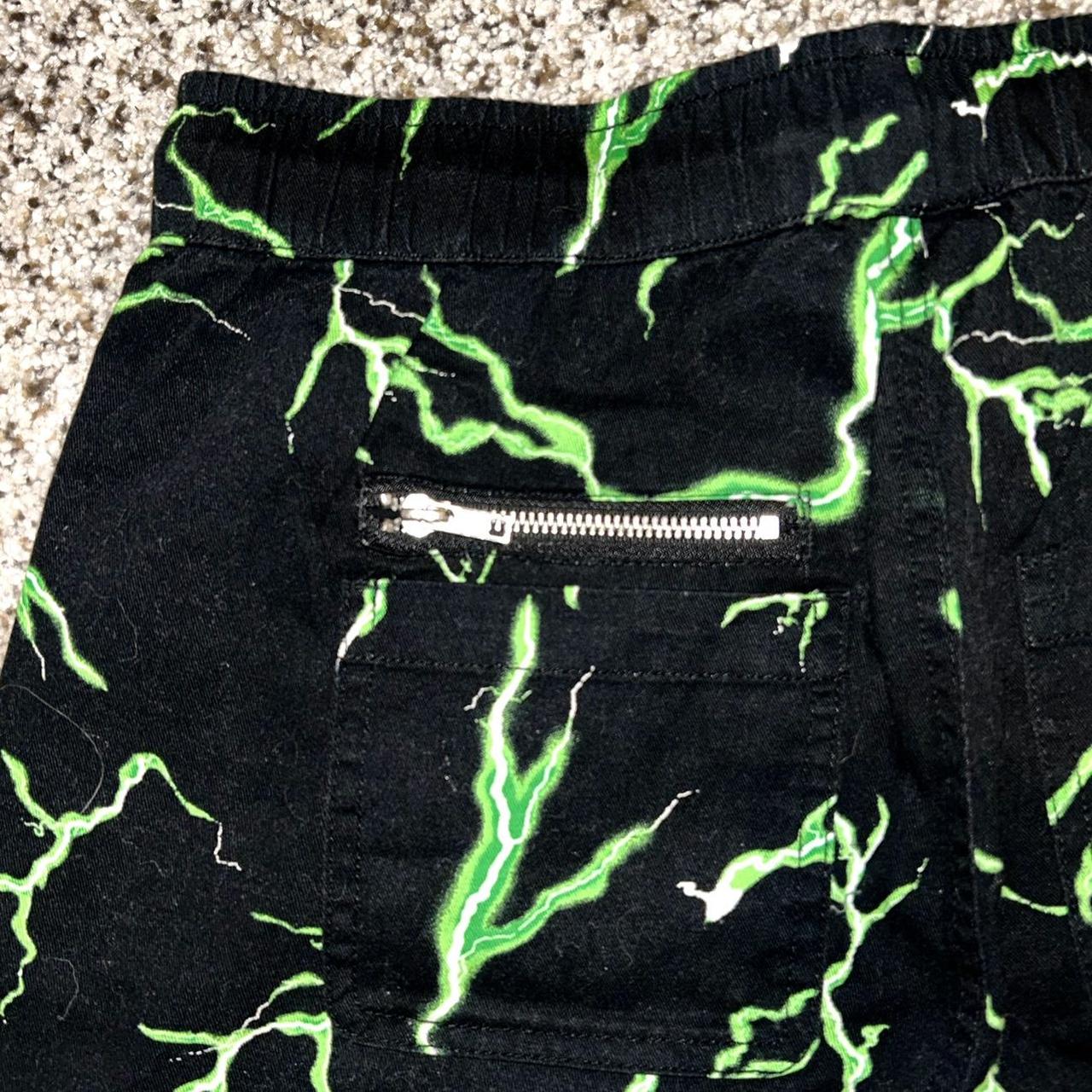 Hot Topic Green Lightning Pants In excellent... - Depop