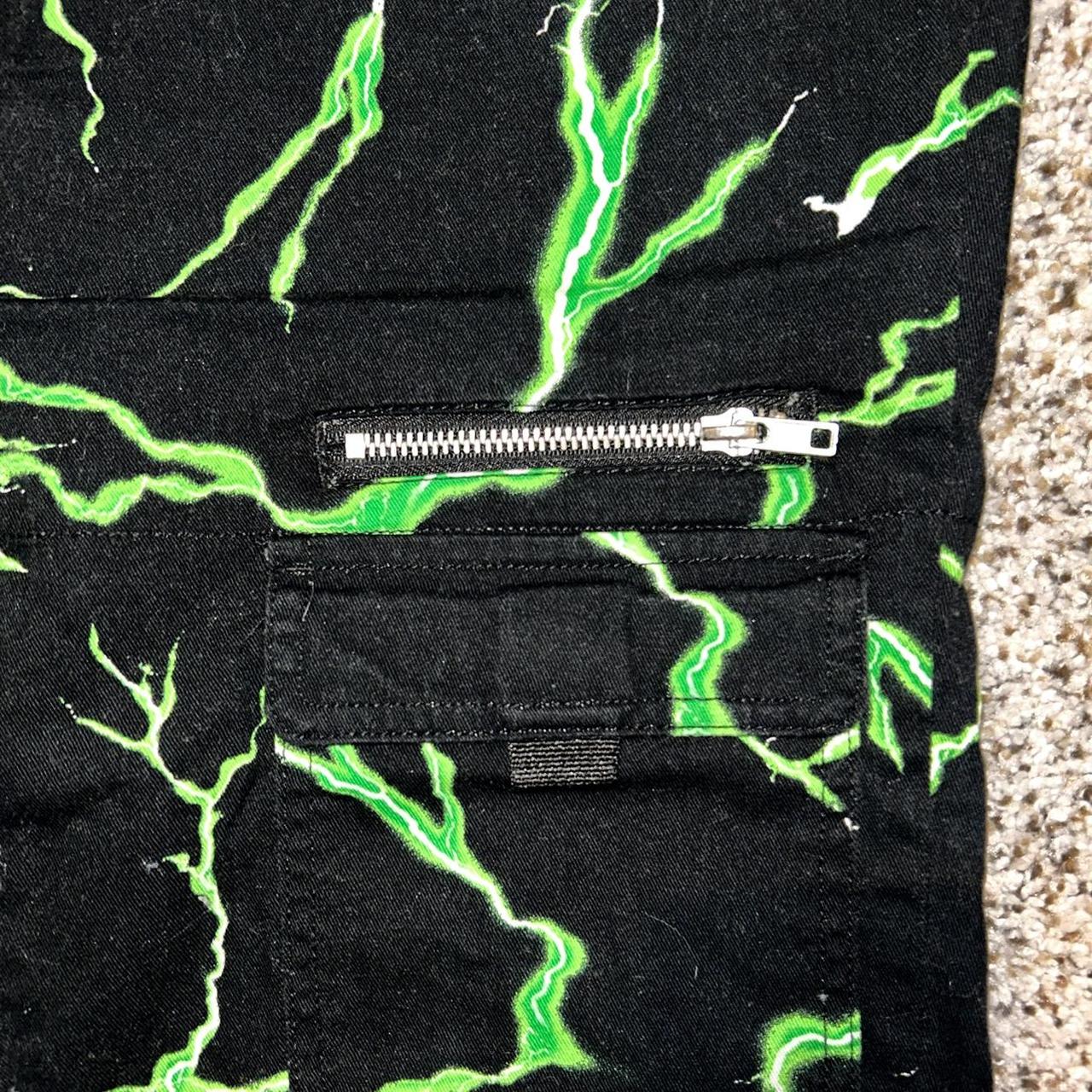 Hot Topic Green Lightning Pants In excellent... - Depop