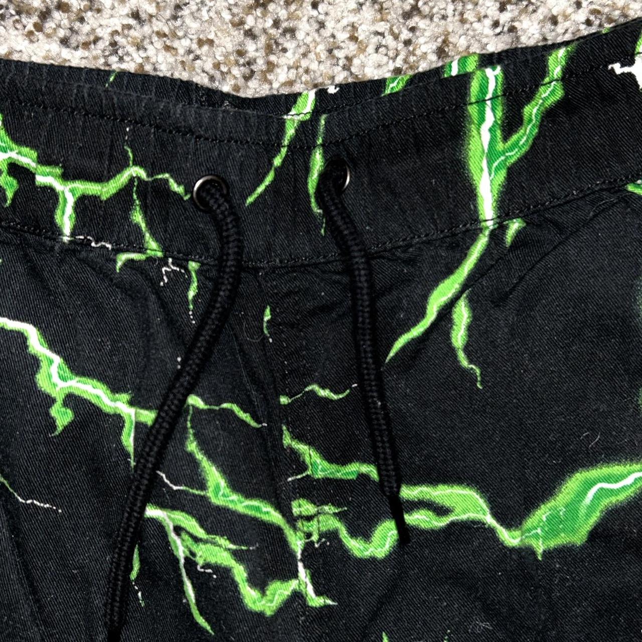 Hot Topic Green Lightning Pants In excellent... - Depop