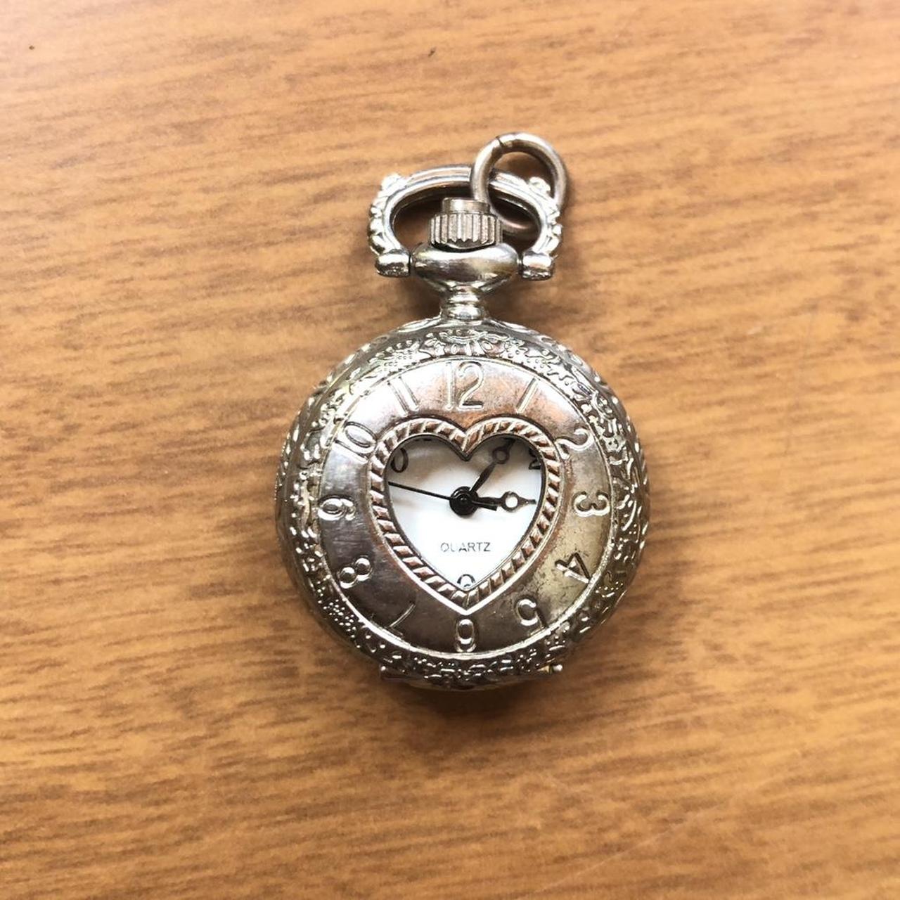 Silver heart-shaped pocket watch pendent with a... | Depop