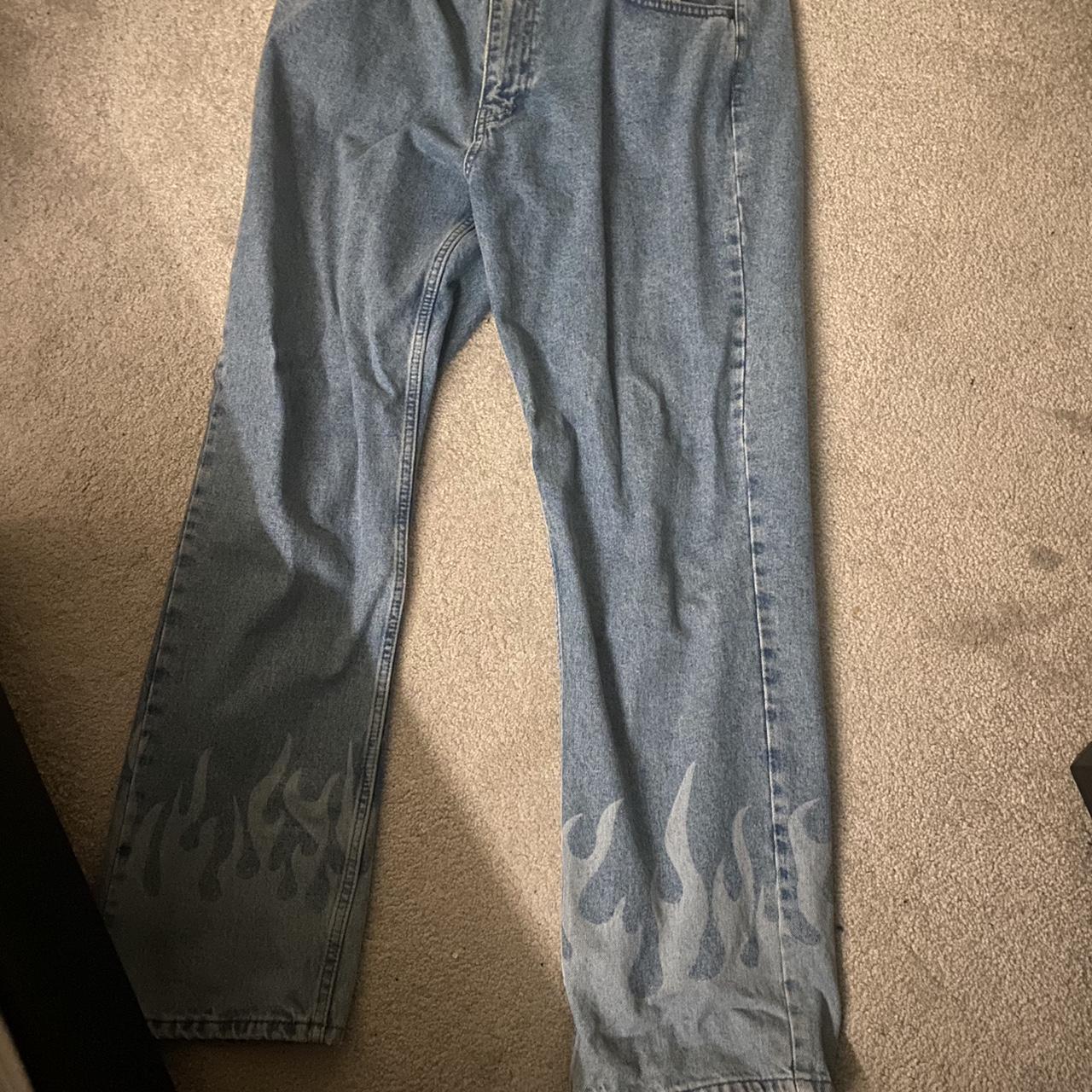 Blue ragged jeans with sick flame design at... - Depop