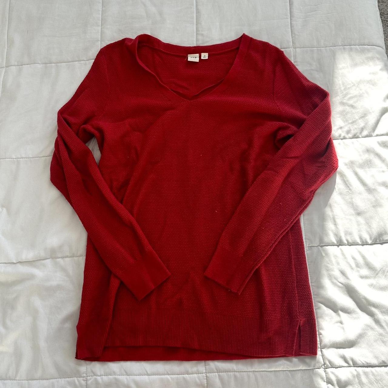 Red V-neck sweater with a slight V-neck and long... - Depop
