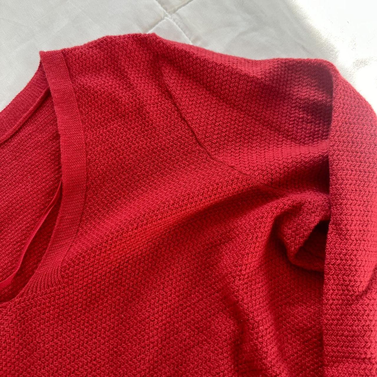 Red V-neck sweater with a slight V-neck and long... - Depop