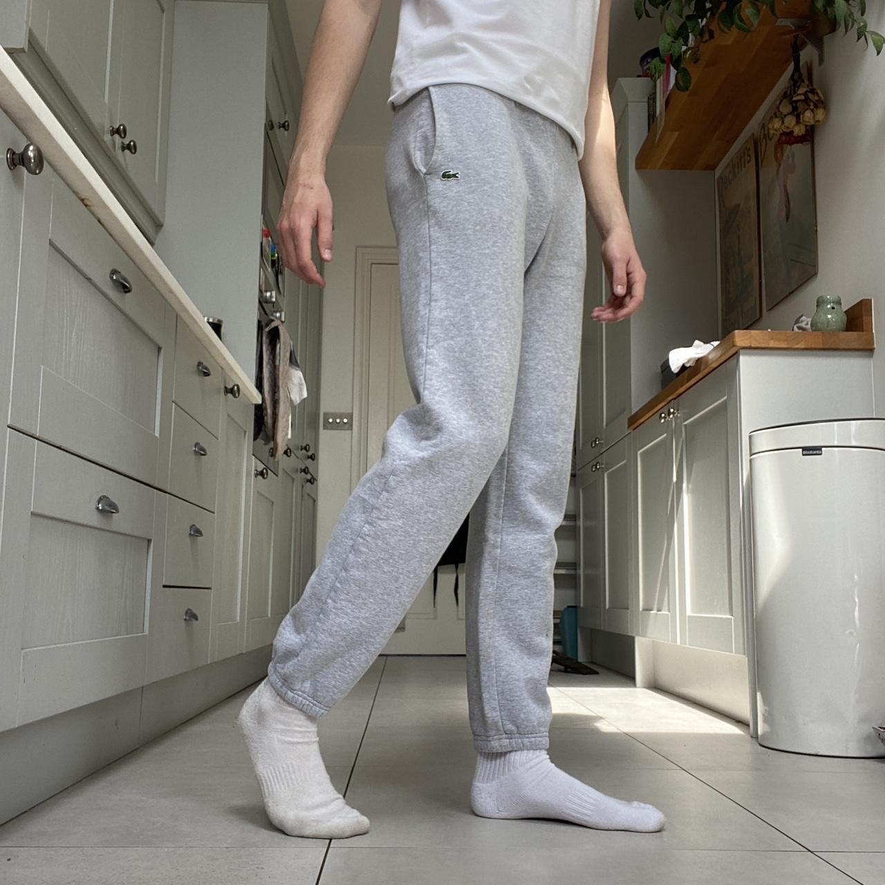 Grey Lacoste Joggers with adjustable drawstring... - Depop