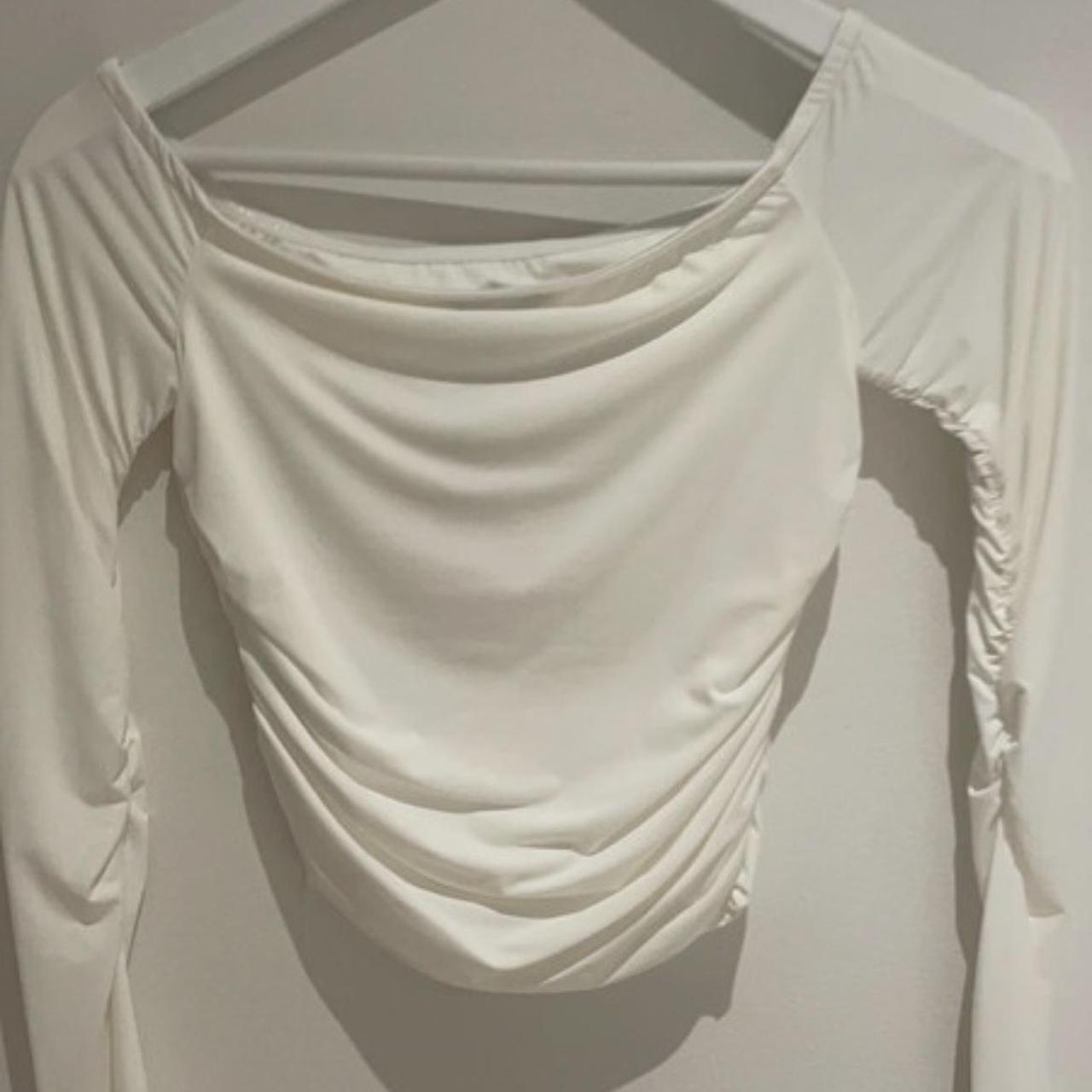 white, well fitted, wide arms, snatched on waist... - Depop