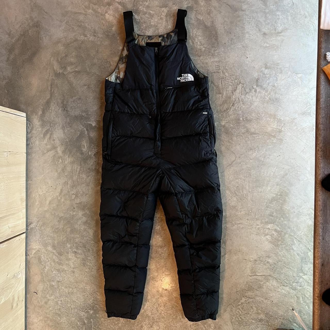 The North Face black puffer overall with Camo inside... - Depop