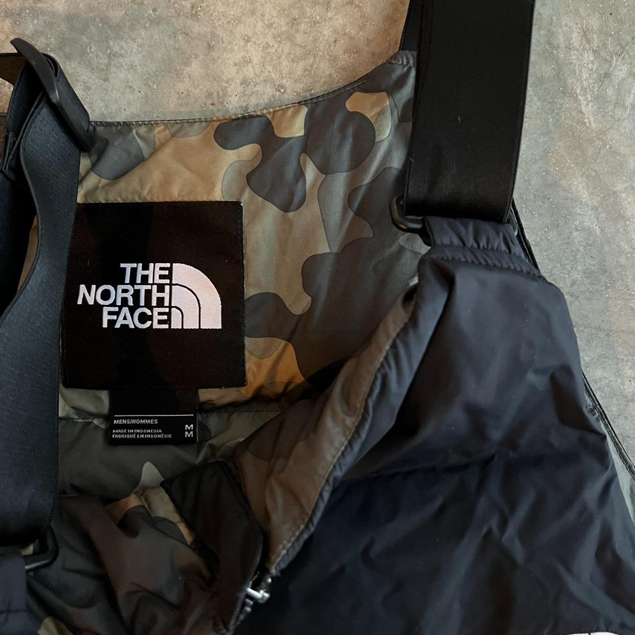 The North Face black puffer overall with Camo inside... - Depop