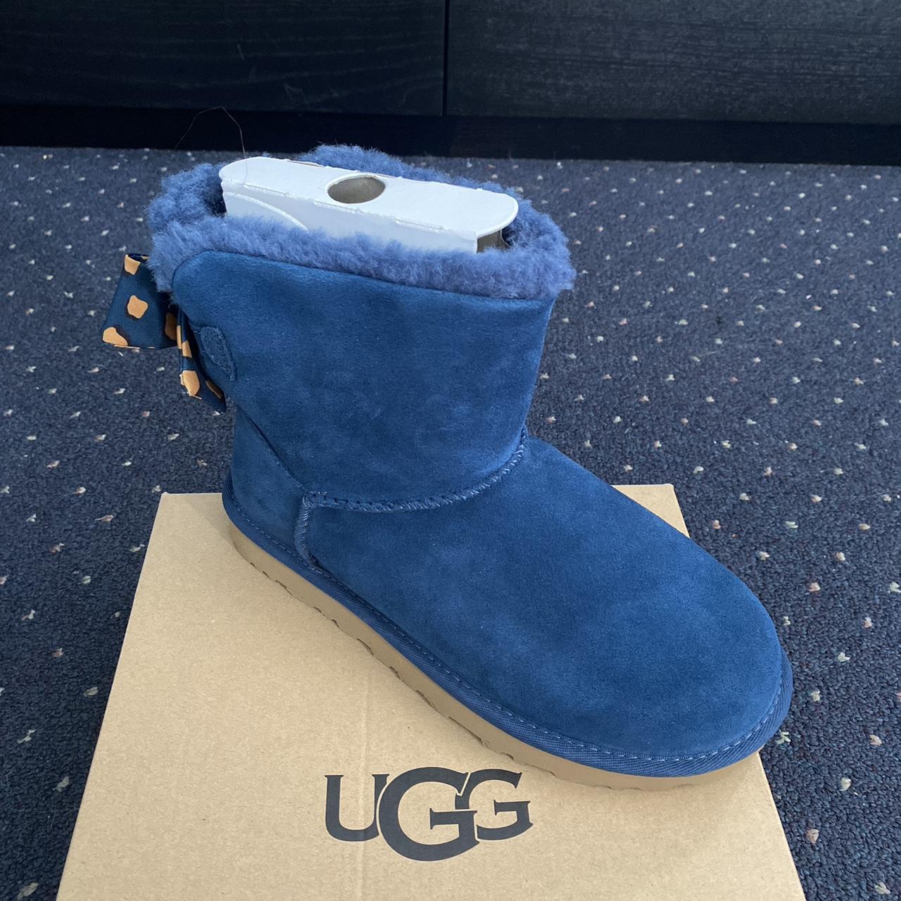 Size 6 womens blue UGG boots with bow - never worn... - Depop
