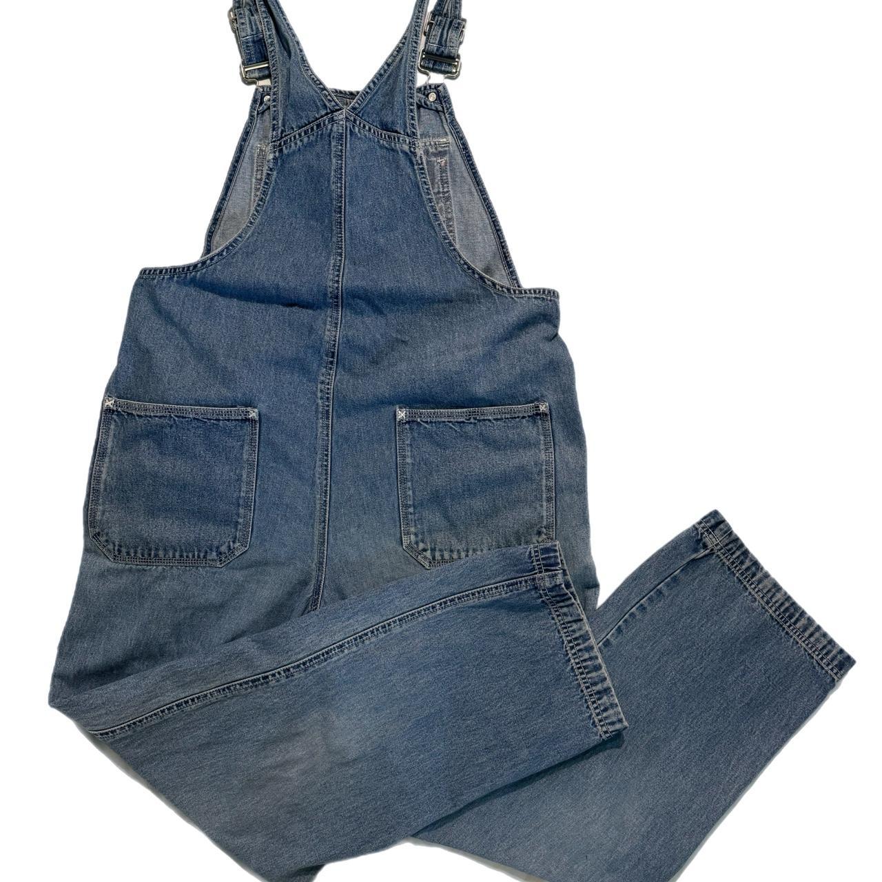 Blue denim overalls with a relaxed fit, featuring a... - Depop