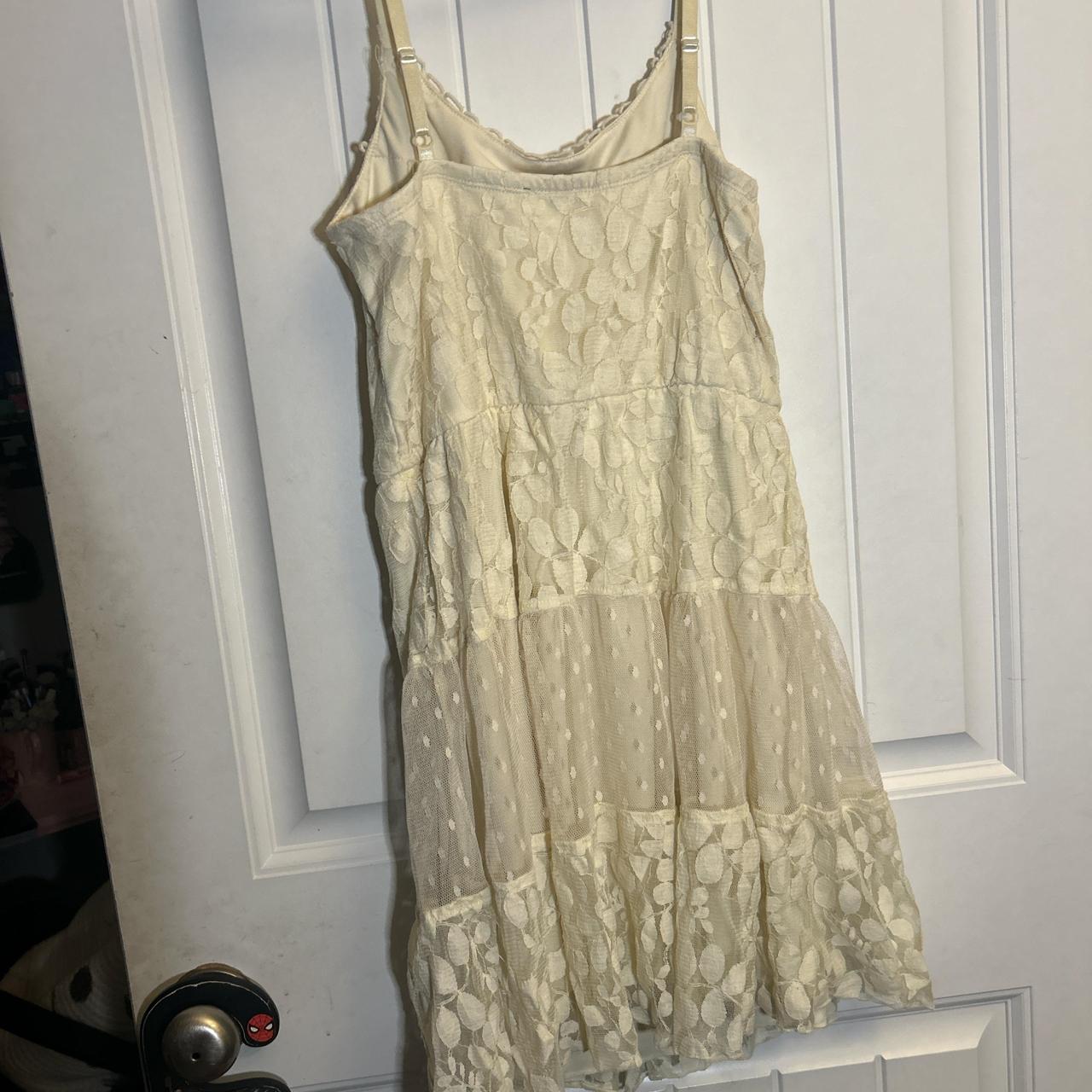 Cream lace mini dress with adjustable straps... | Depop