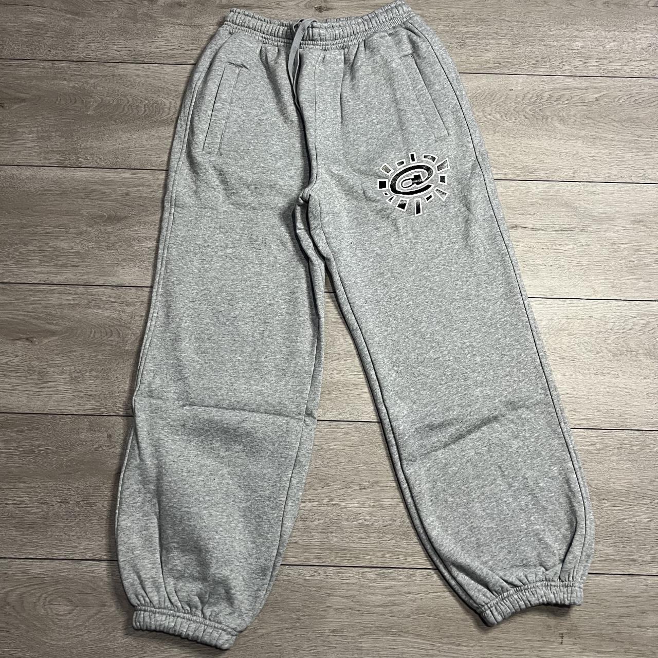 ADWYSD Grey cotton logo patched cuffed joggers... | Depop