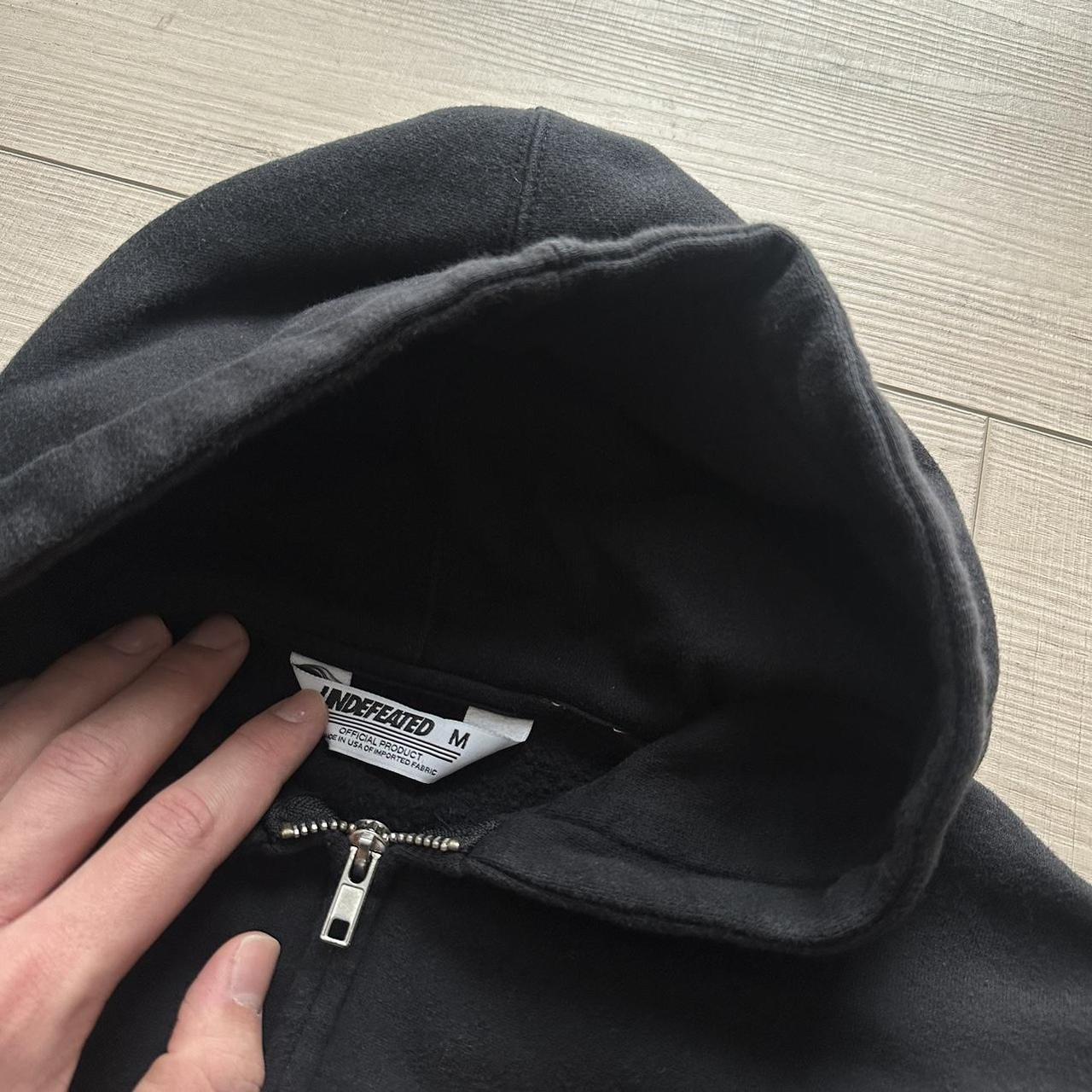Undefeated Zip Up Hoodie Flaws pictured Size M - Depop