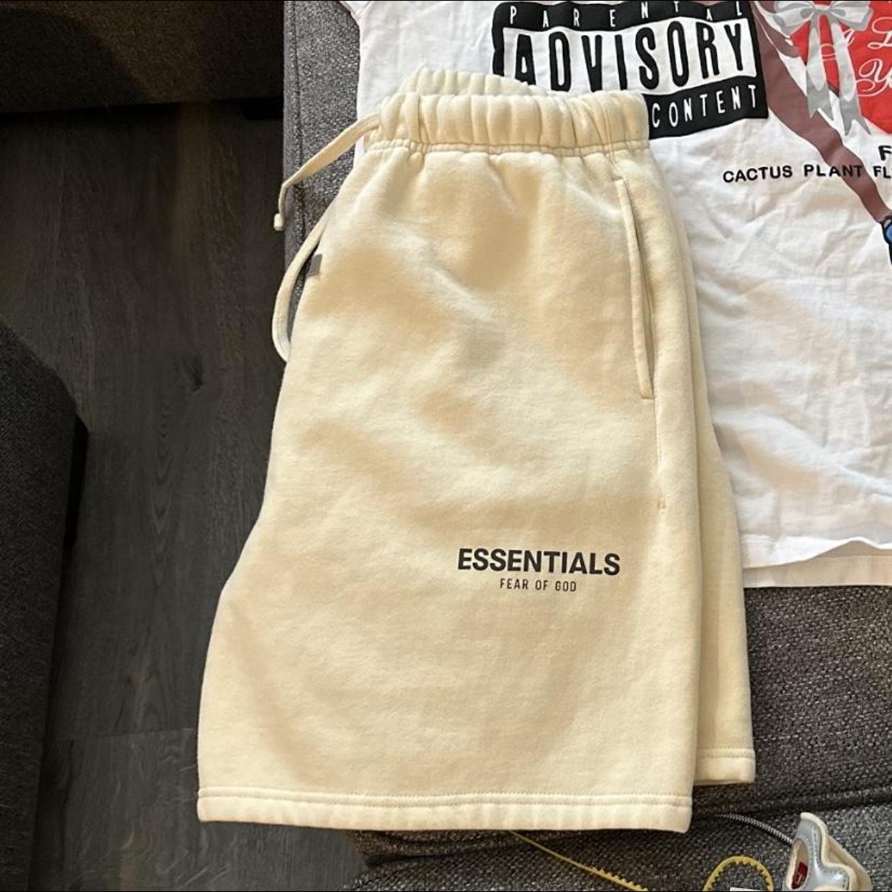 Fear of God Essentials Shorts, yellowish cream.... - Depop