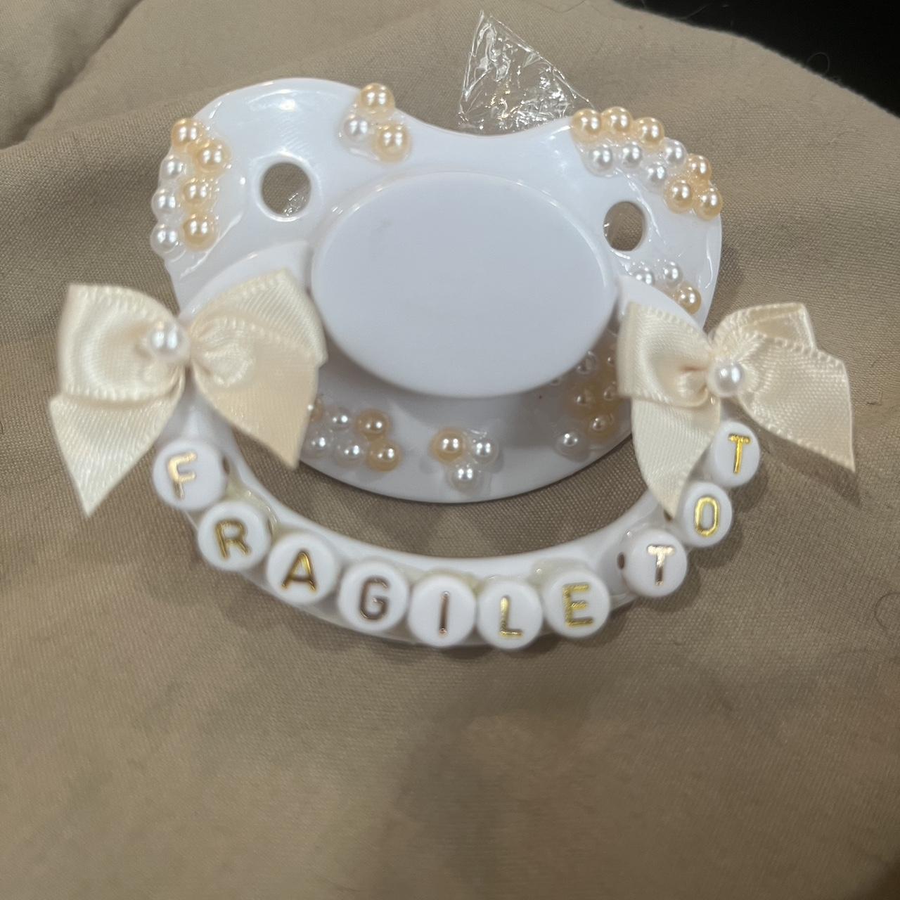 Agere adult pacifier Glue has slightly yellowed on... | Depop