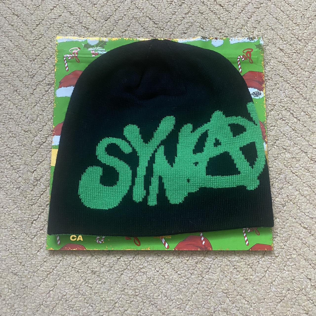 Syna world beanie brand new comes with all the... - Depop