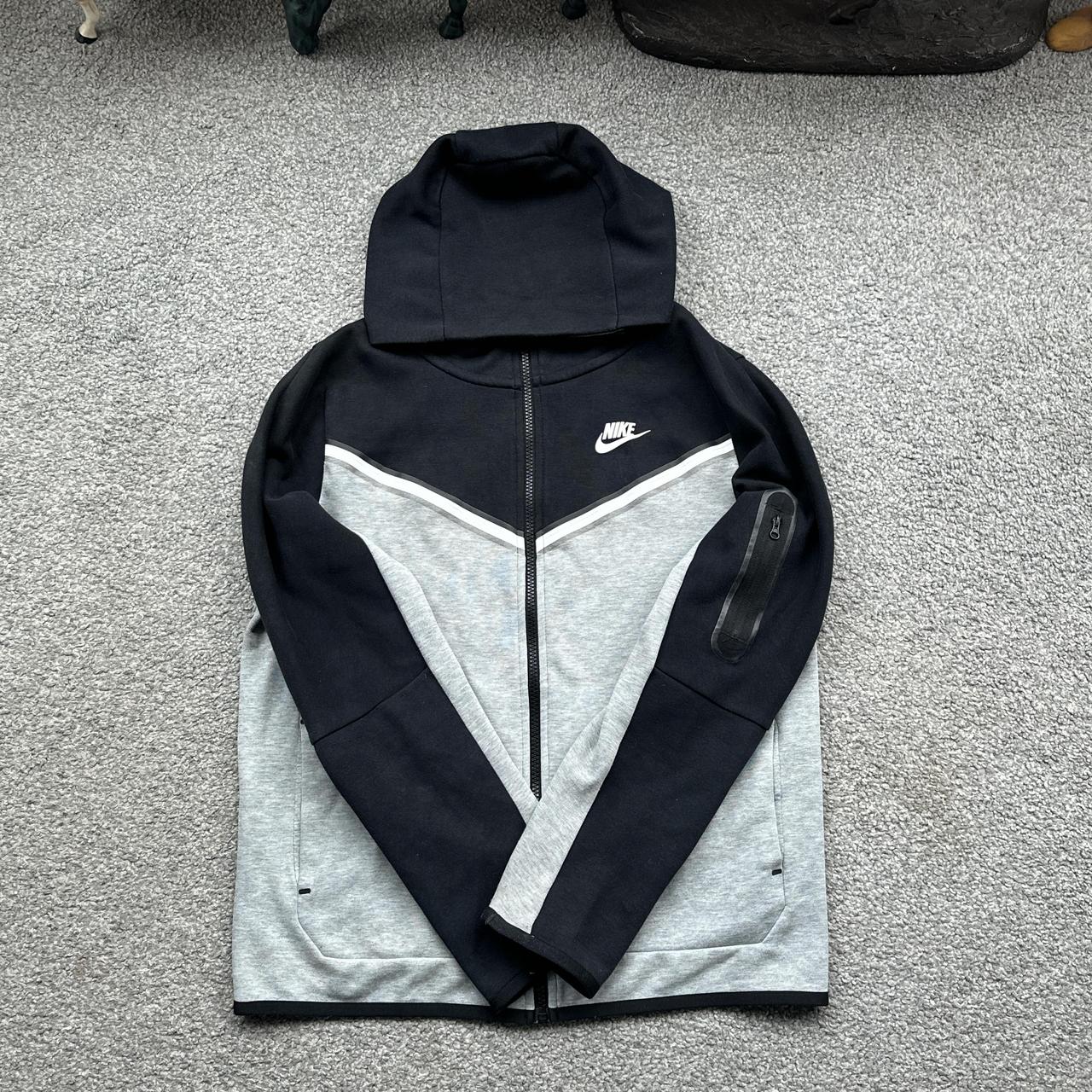 grey and black nike tech kids xl worn lots but in... - Depop