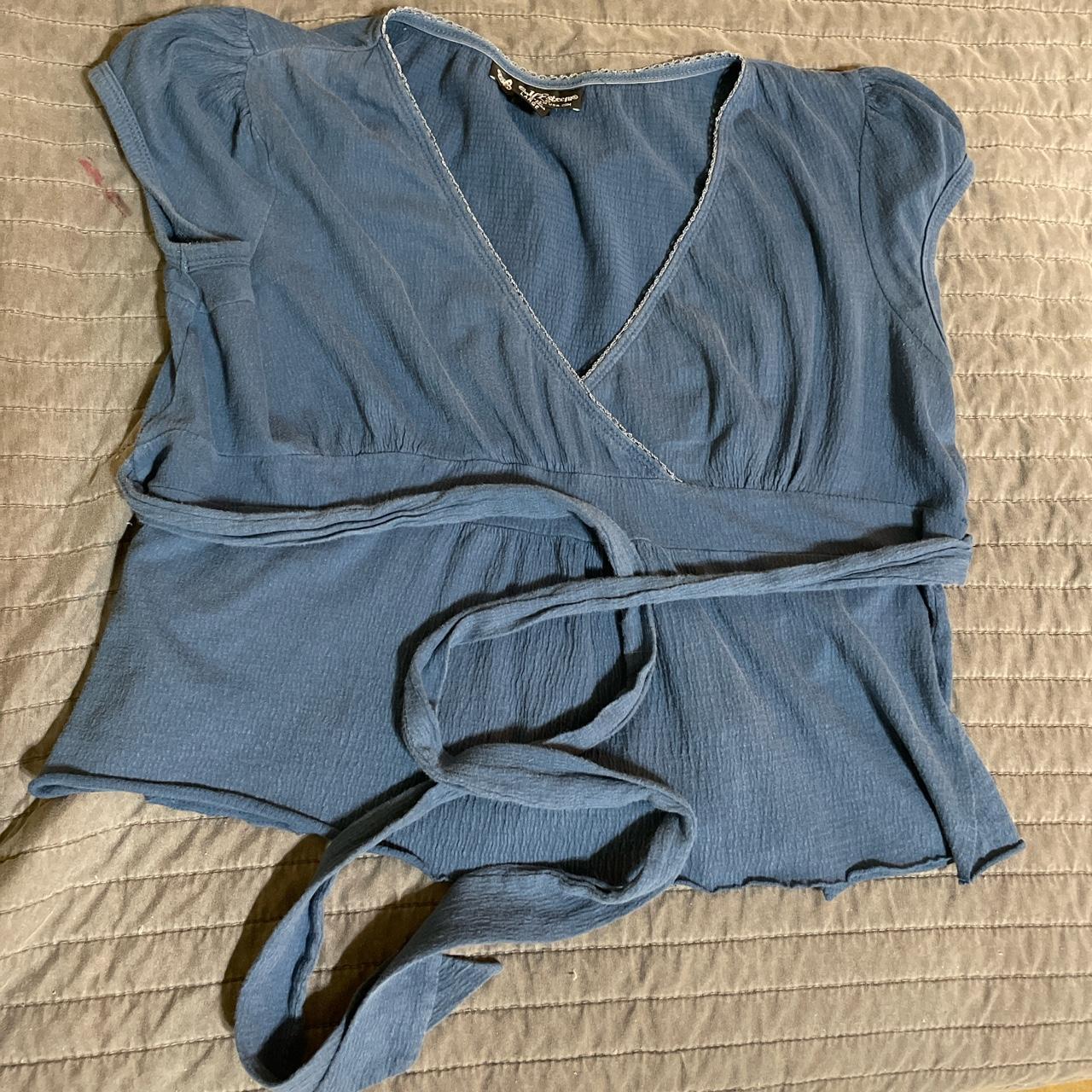 cute blue top..strings snatch waist..would say fit... - Depop