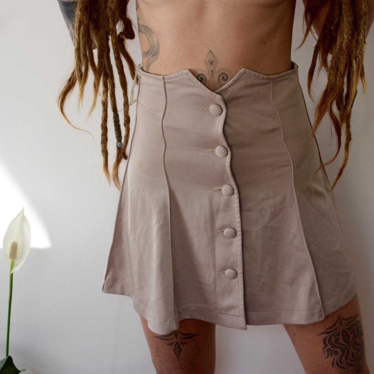 Cutest lil mini skirt With flattering high-waisted... - Depop