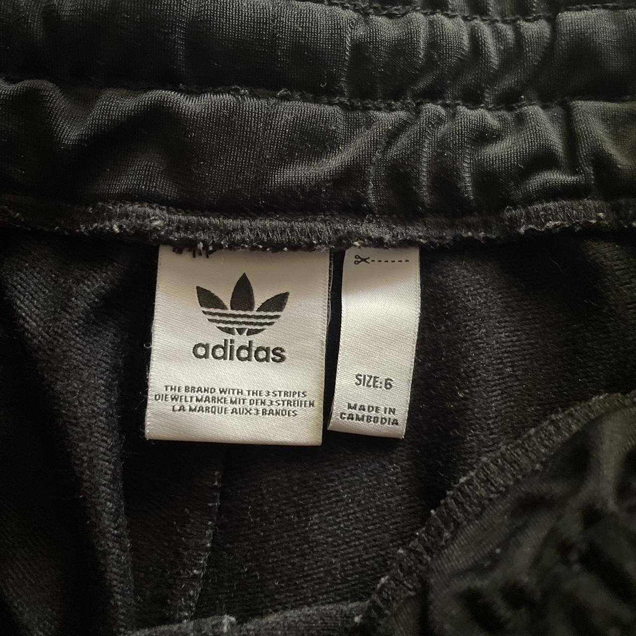 black adidas trackies pick up in darch or can be... - Depop