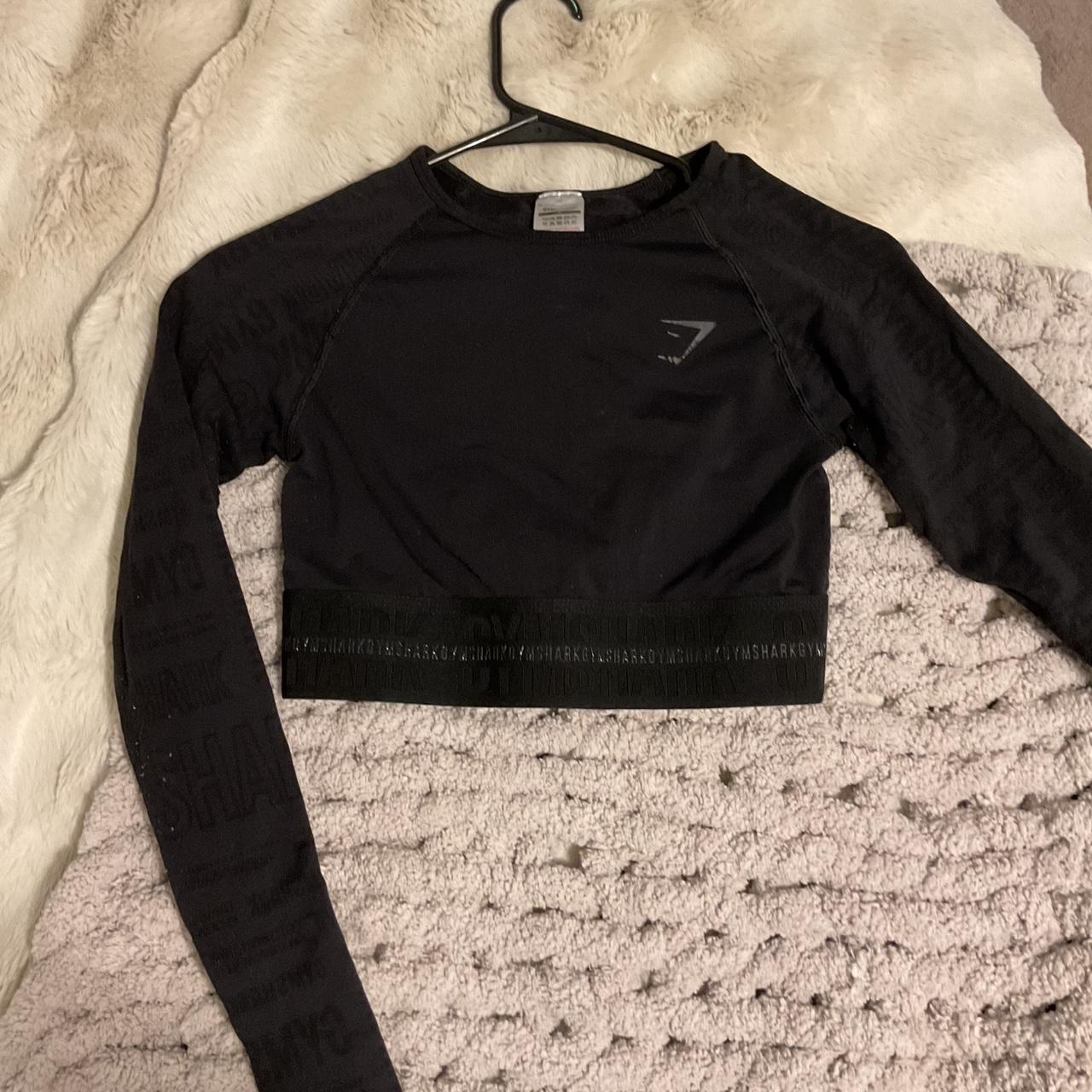 Black Gymshark cropped workout top, label has fading... | Depop
