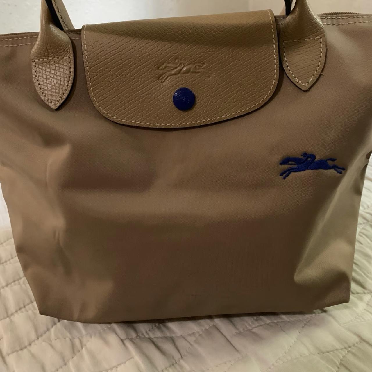 Longchamp bag Longchamp tan bag with blue button.... - Depop