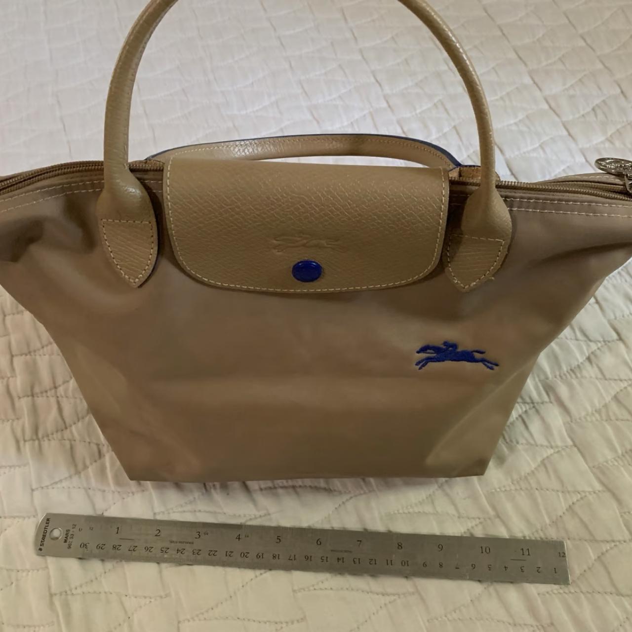 Longchamp bag Longchamp tan bag with blue button.... - Depop