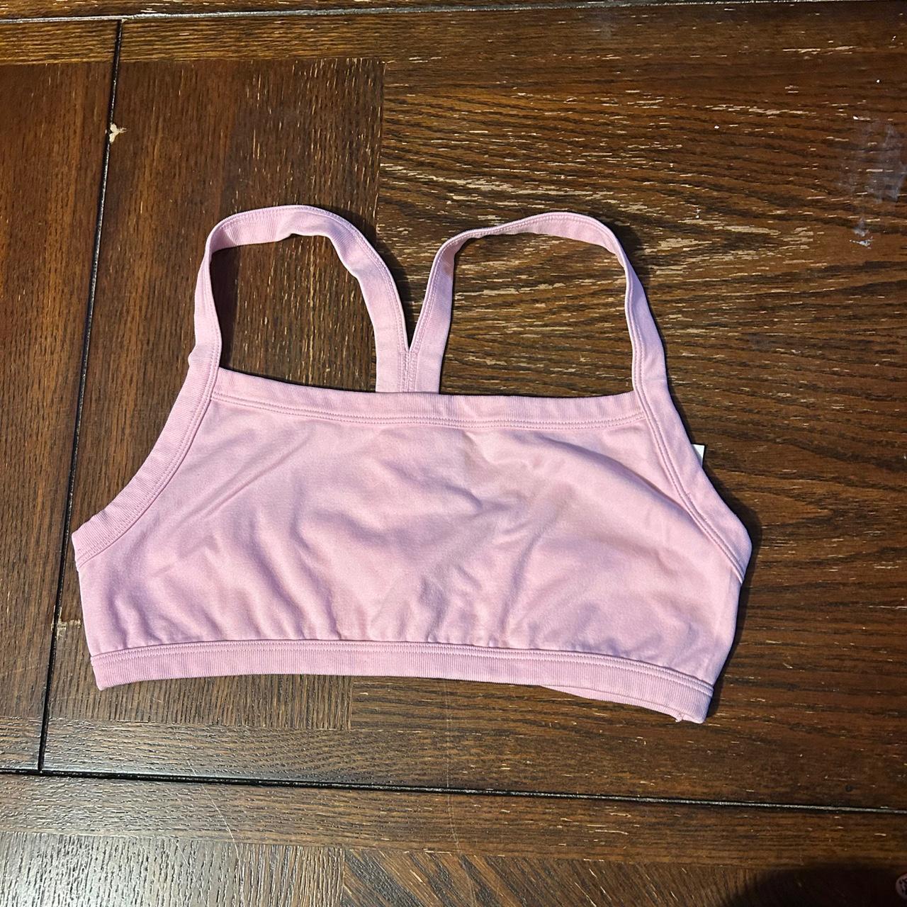 Pink sports bra labeled a XL but fits a medium/larger | Depop