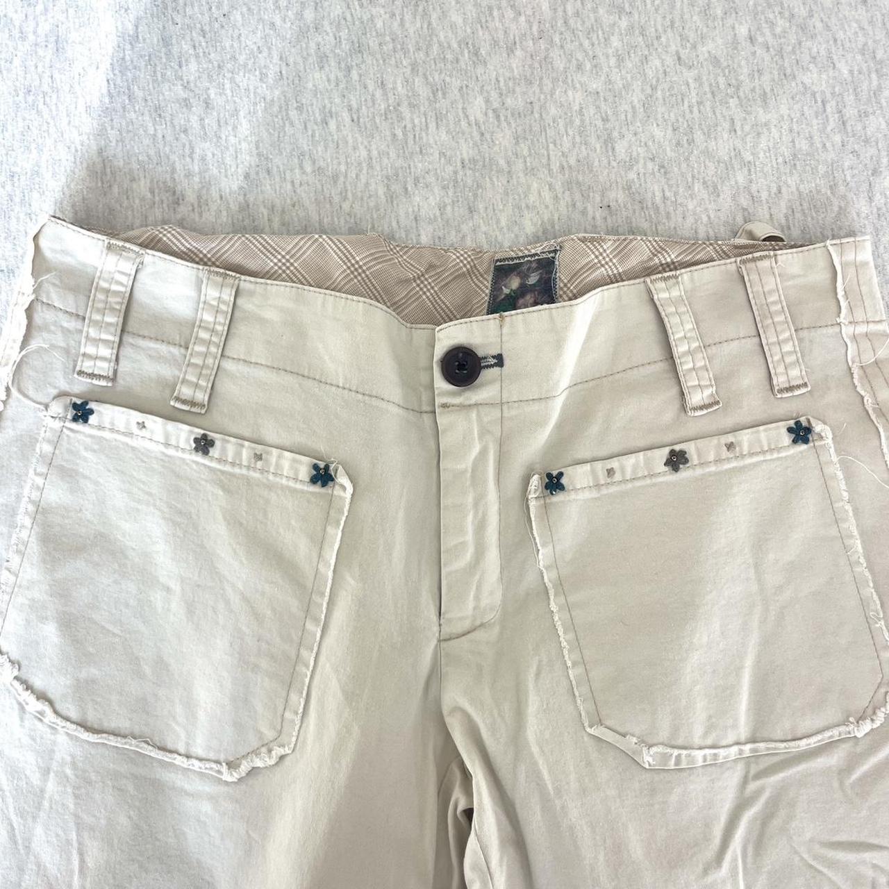 Cream capri pants with blue embroidered flowers. The... - Depop
